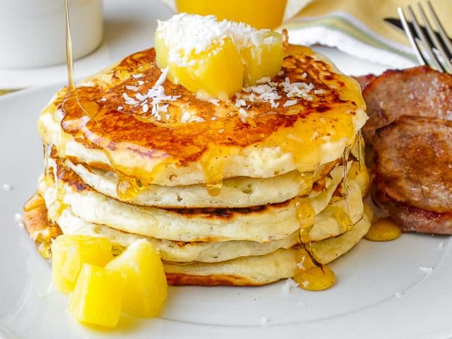 Pina Colada Pancakes with Vanilla Rum Syrup for the perfect brunch!